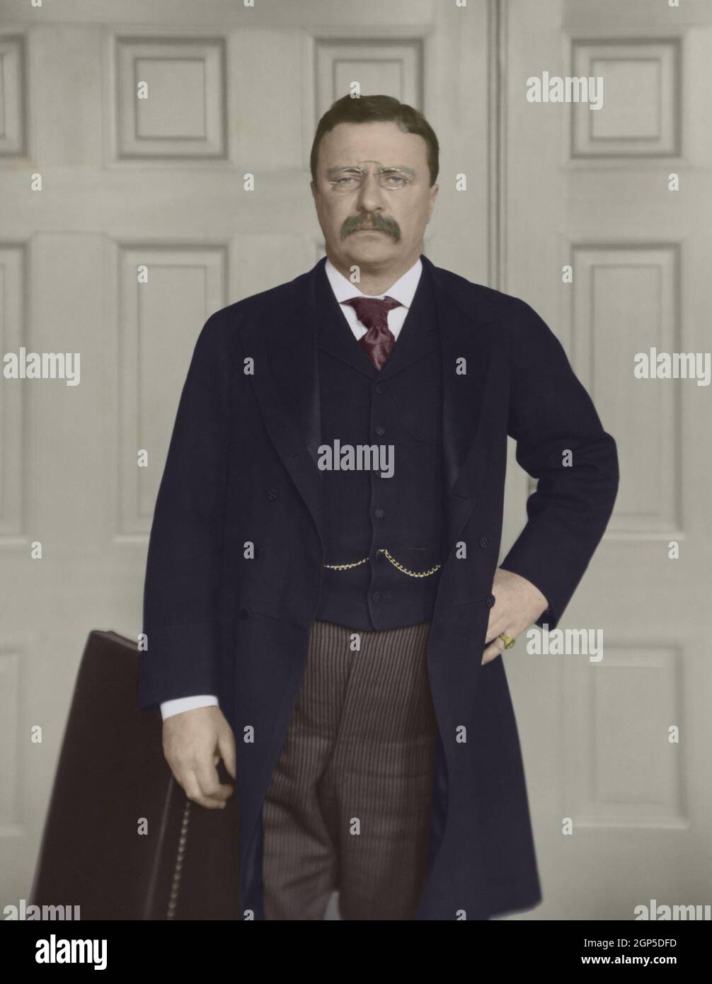 President Theodore Roosevelt standing before the double doors of his ...