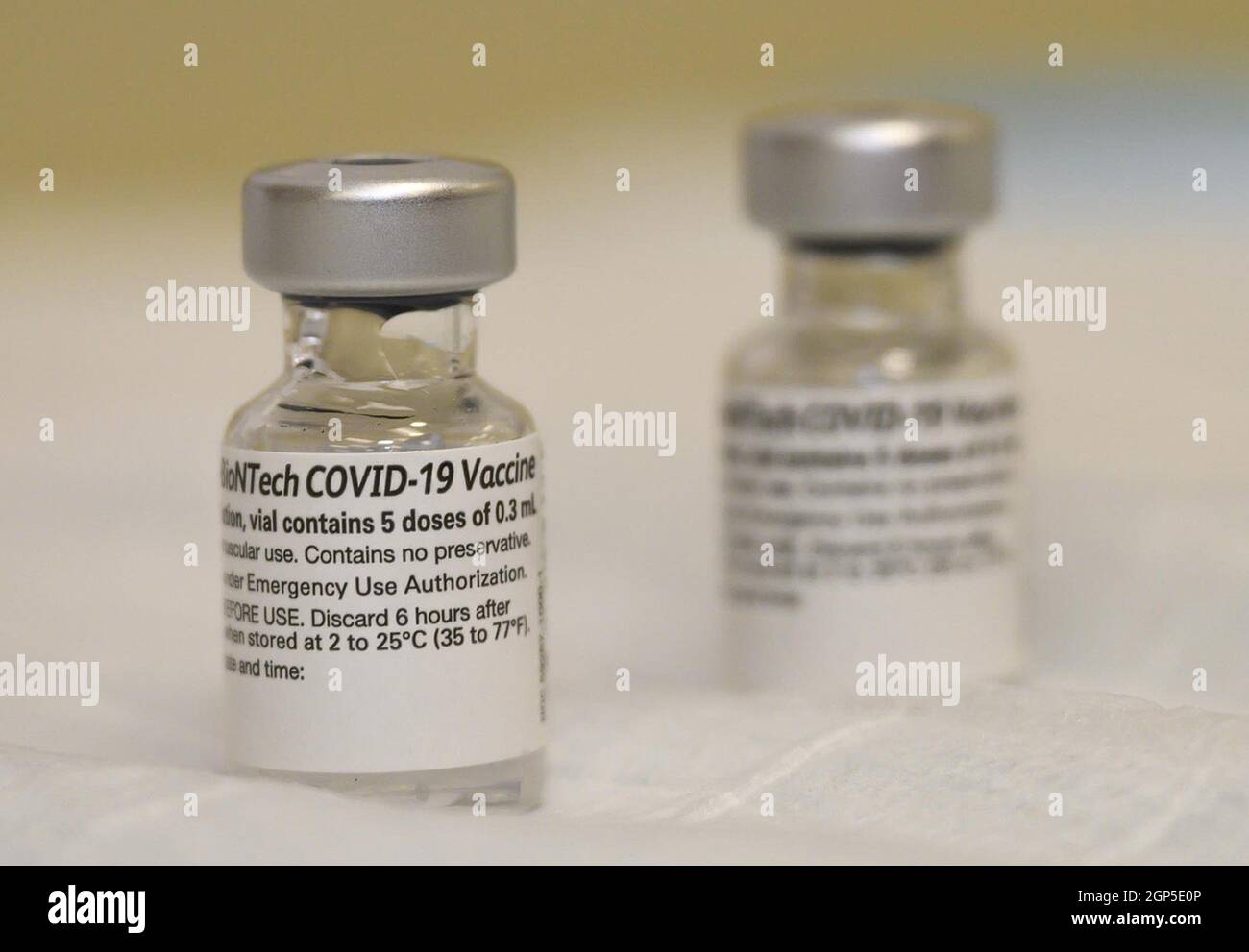 Pfizer-BioNTech COVID-19 vaccine vials. The vaccine was authorized for ...