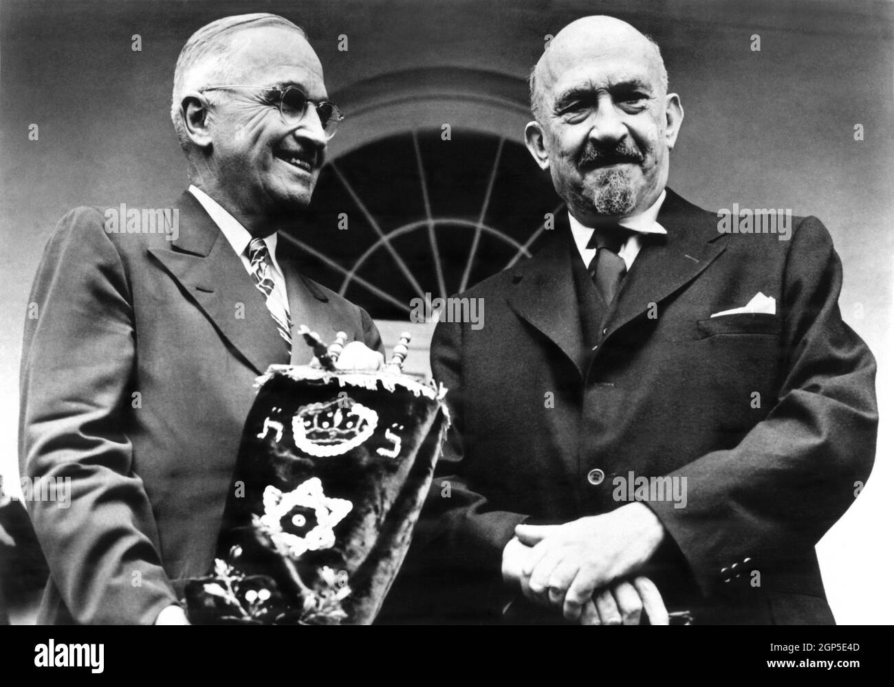 President Truman accepts a Torah from Chaim Weissman, the former ...