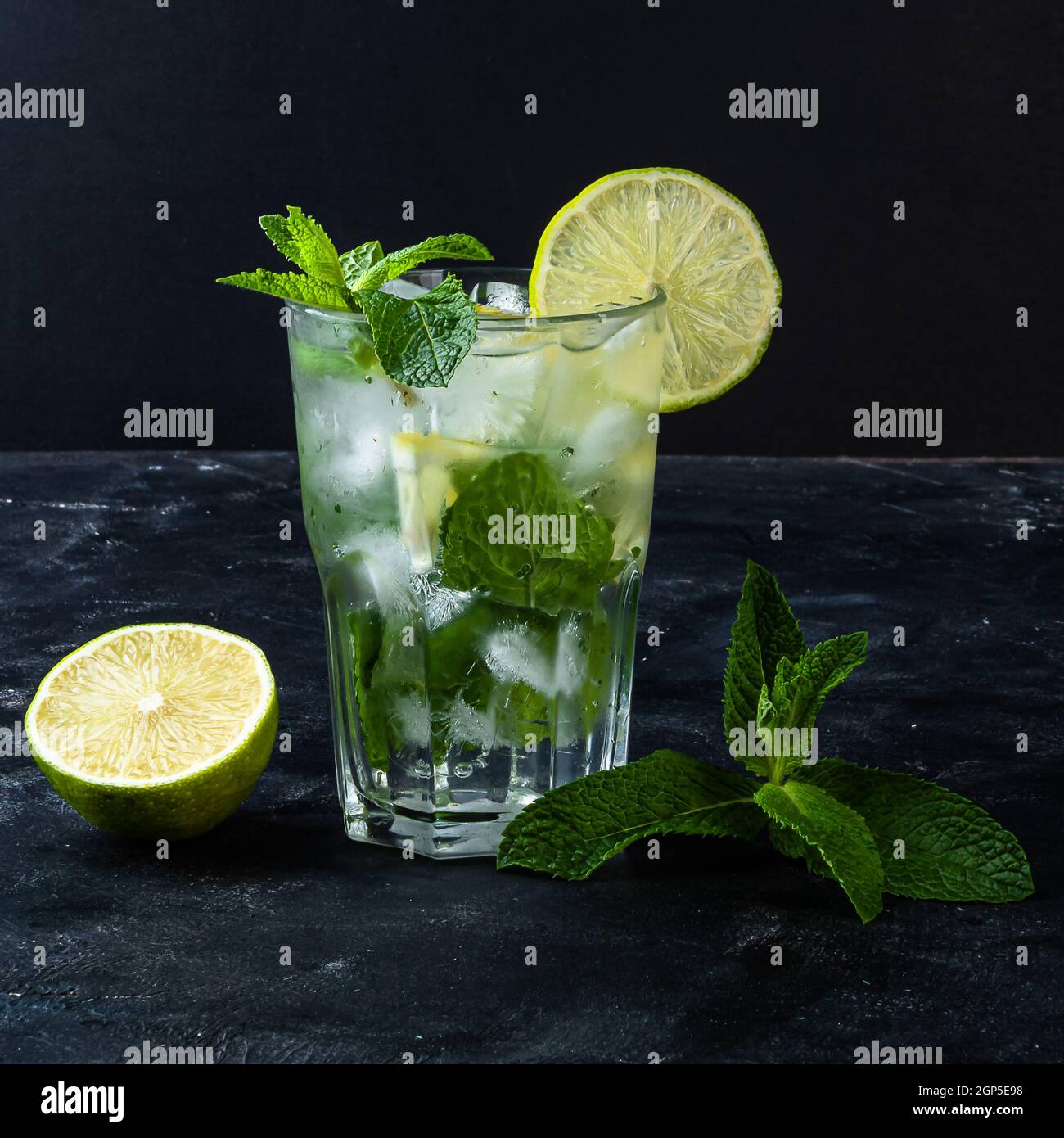 Refreshing summer alcoholic cocktail mojito with ice, fresh mint and ...
