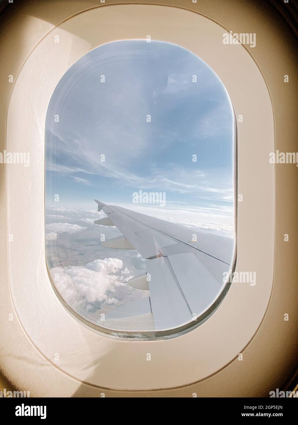 Detail of the window of a plane with the wing on it Stock Photo - Alamy