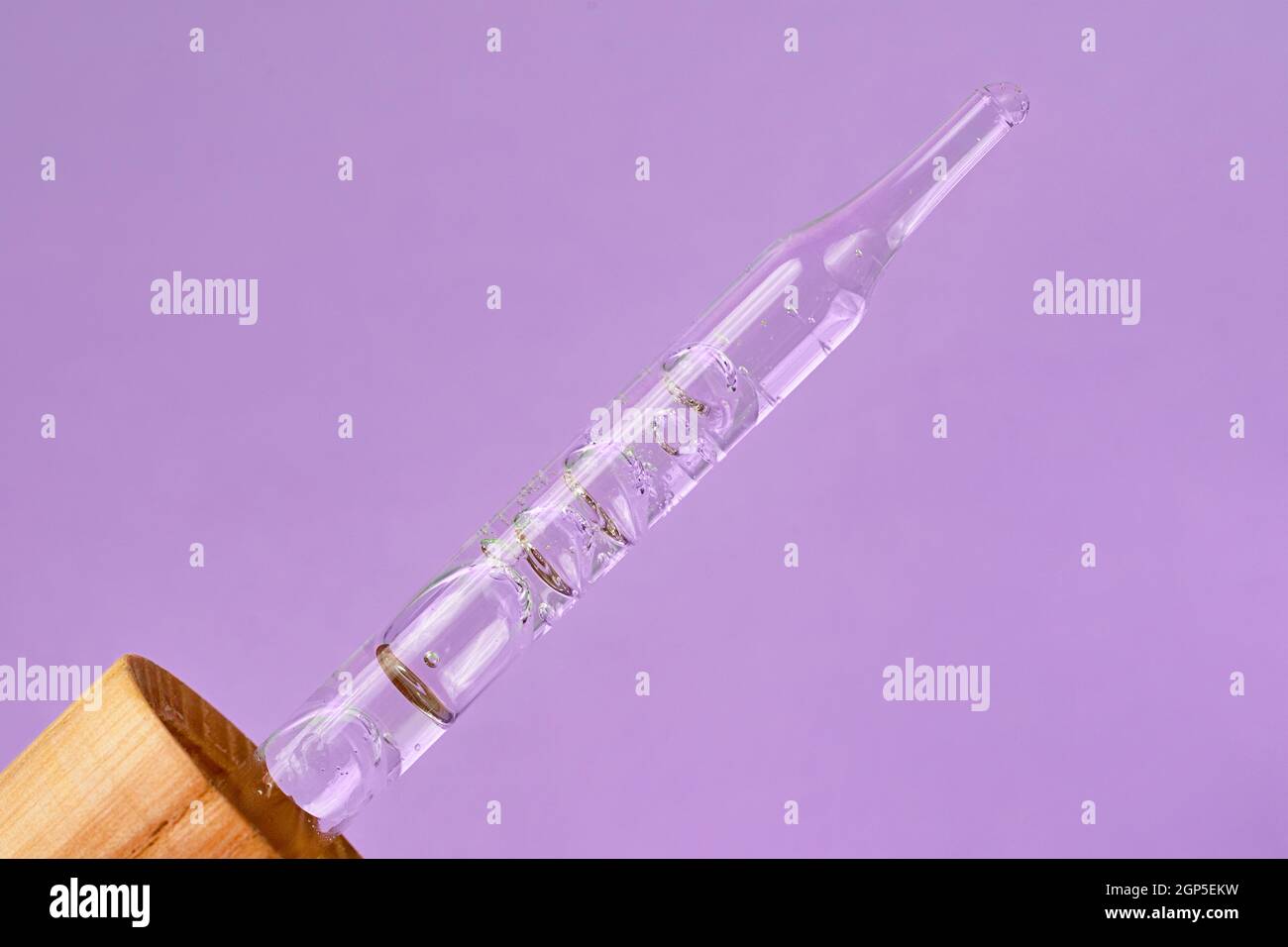 Closeup photography of the pipette with dripping gel.Zero waste wooden ...