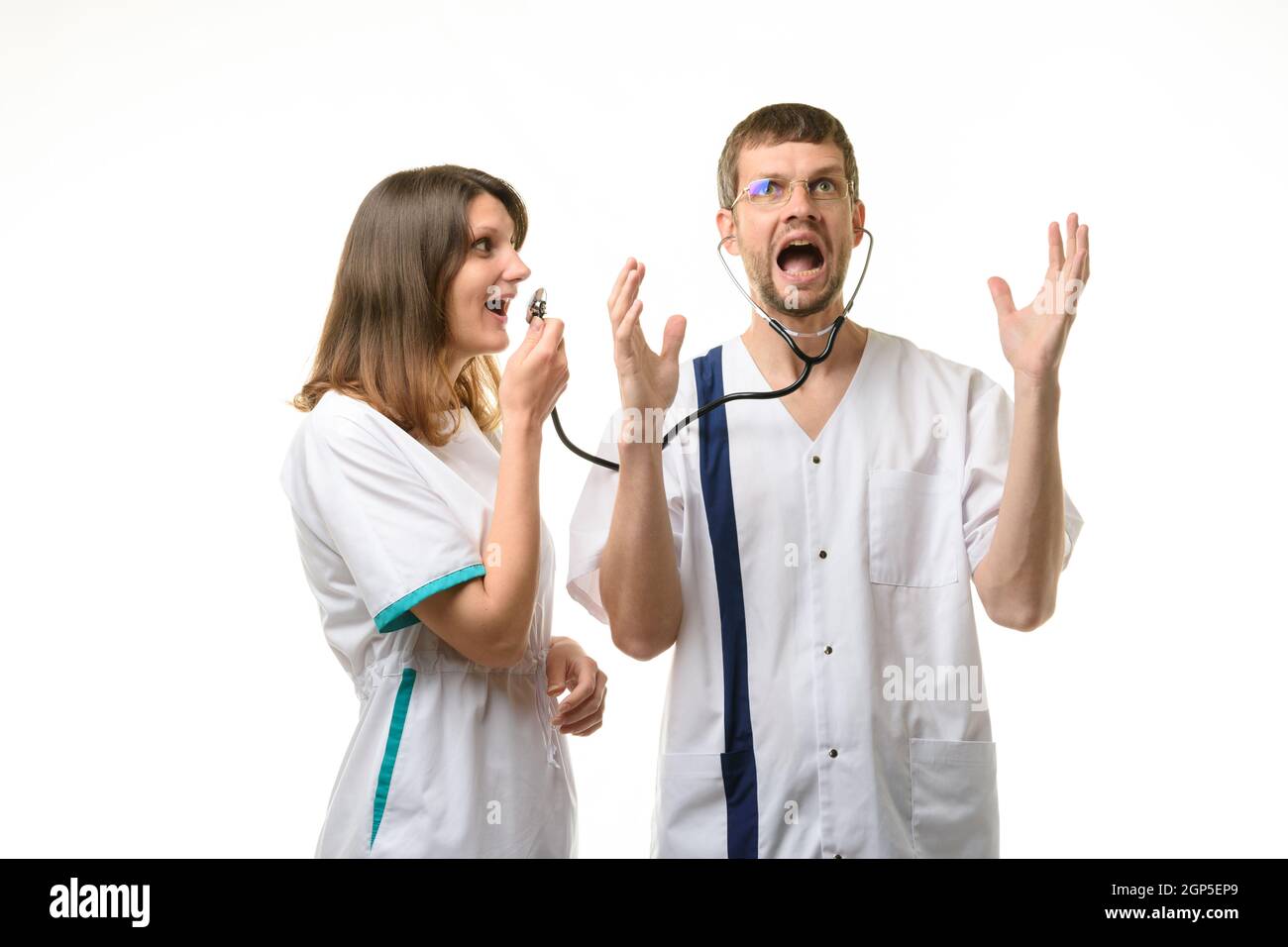 Girl doctor screams into the head of the phonendoscope worn by the ...