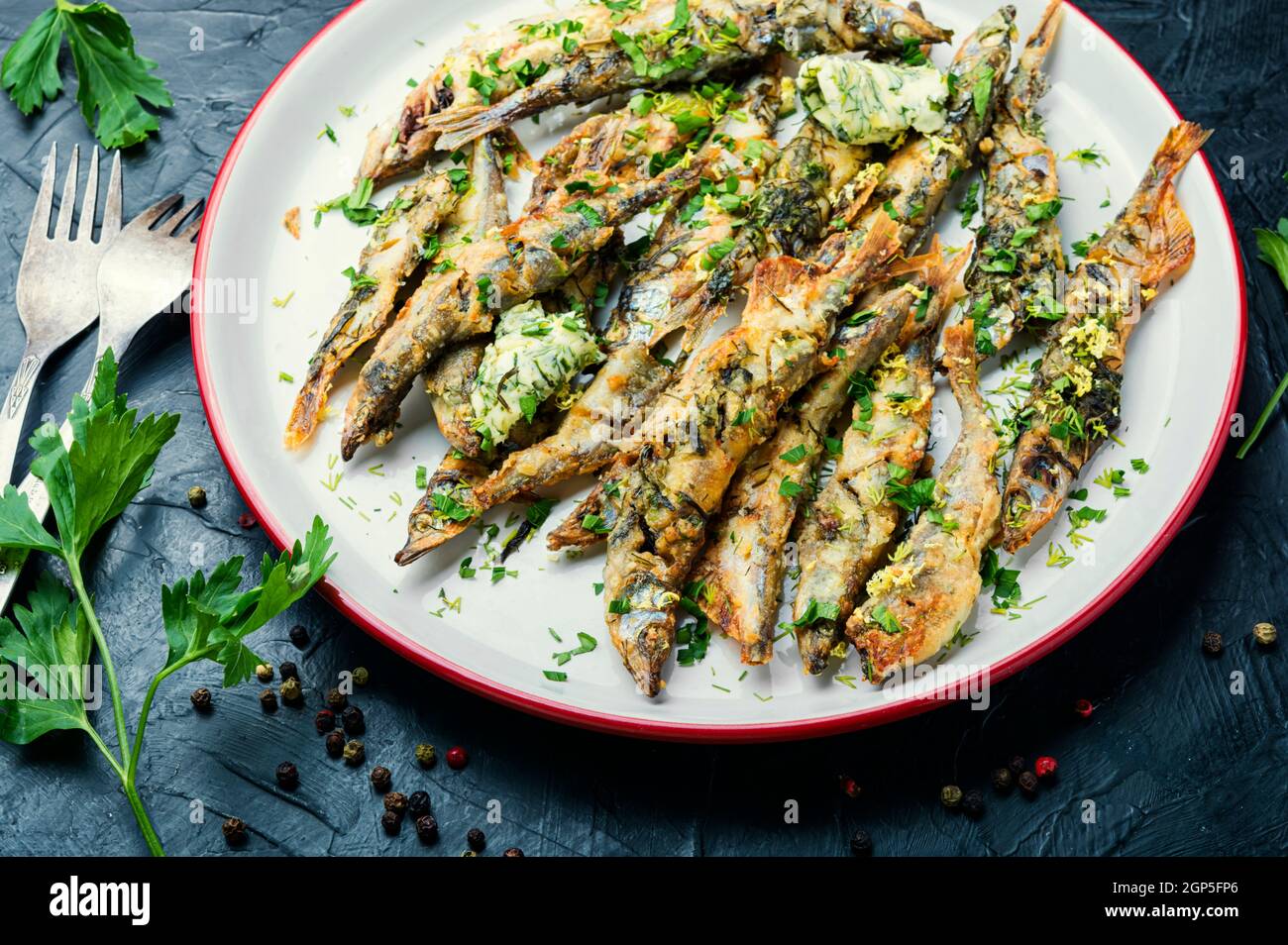 Fried capelin fish with herbs and lemon zest.Fish dish Stock Photo - Alamy