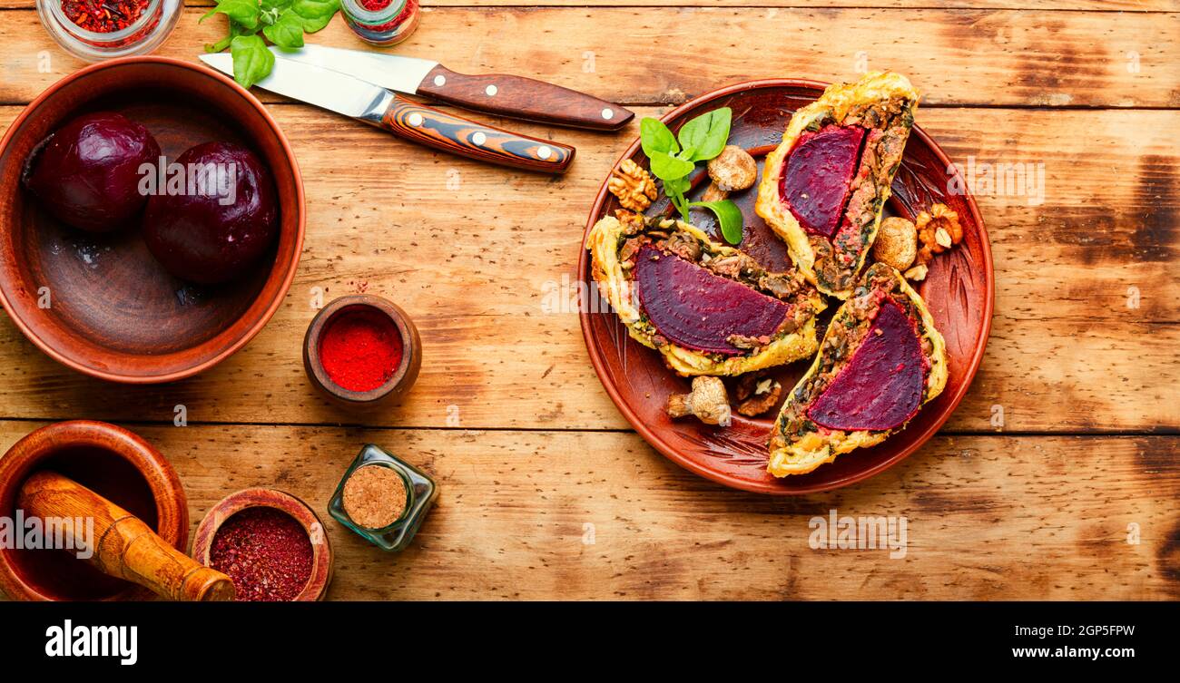 Delicious beetroot pie sliced on a plate.Wellington vegetable pie Stock ...