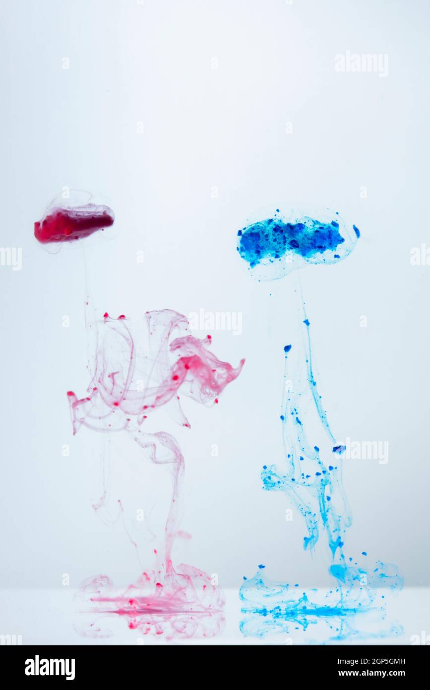 Coloured shapes and flows in liquid Stock Photo - Alamy