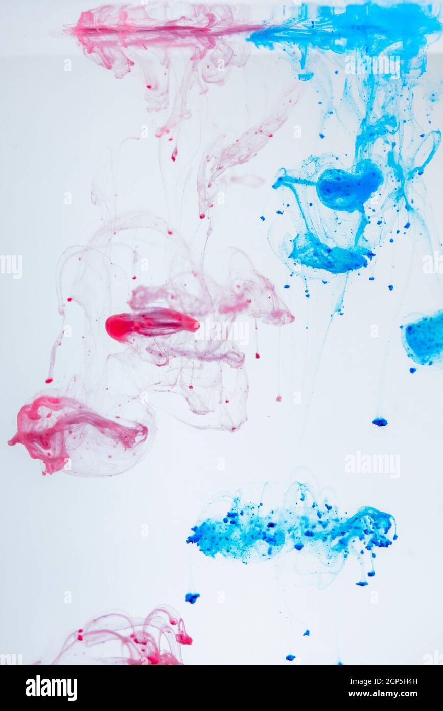 Coloured shapes and flows in liquid Stock Photo - Alamy