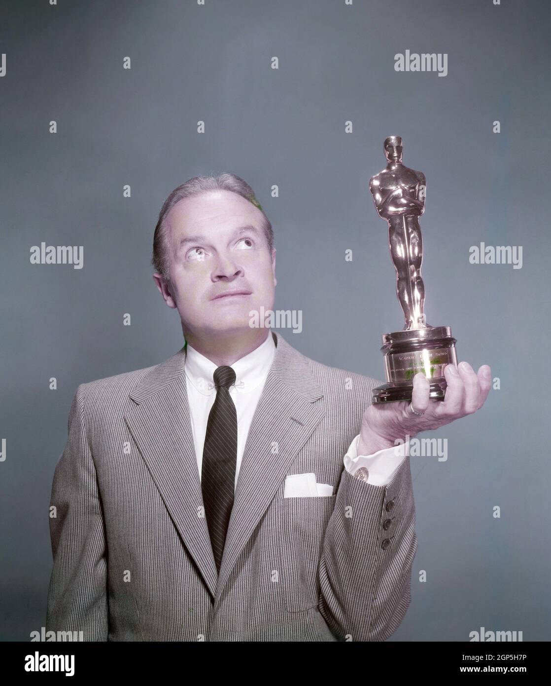 Bob Hope, who often hosted the Academy Awards presentation, holding an ...