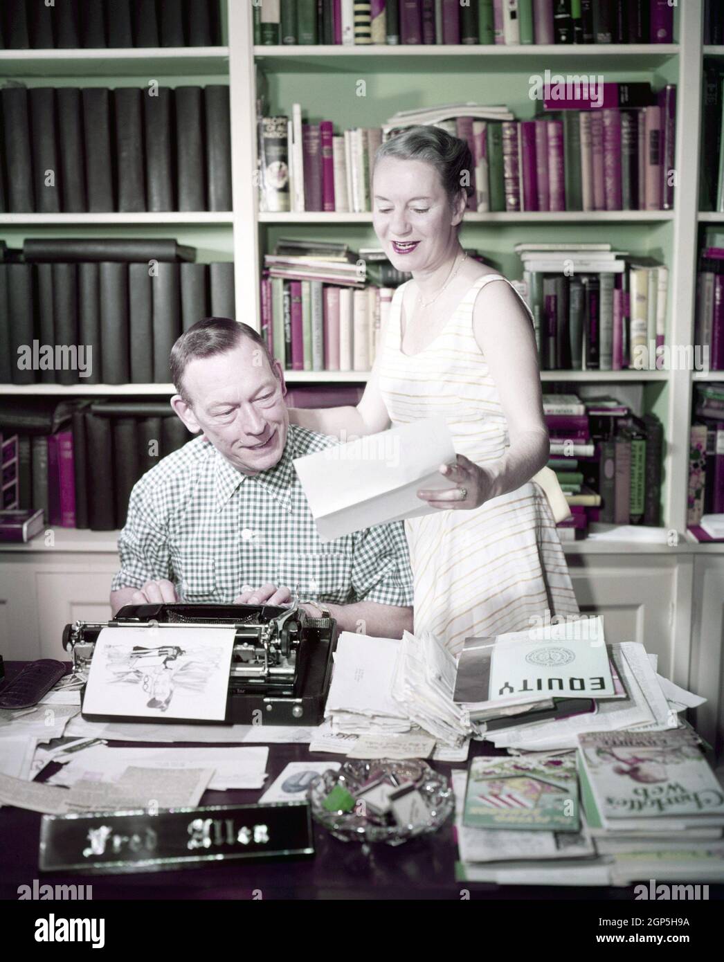 From left: Fred Allen, Portland Hoffa, at his desk,circa 1950s Stock ...