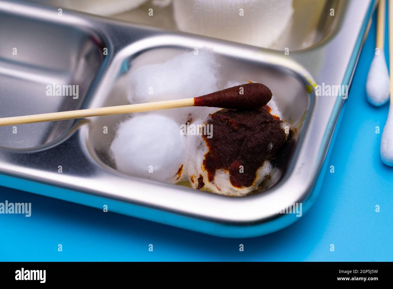 Wound care dressing set and stainless steel plate on blue background ...