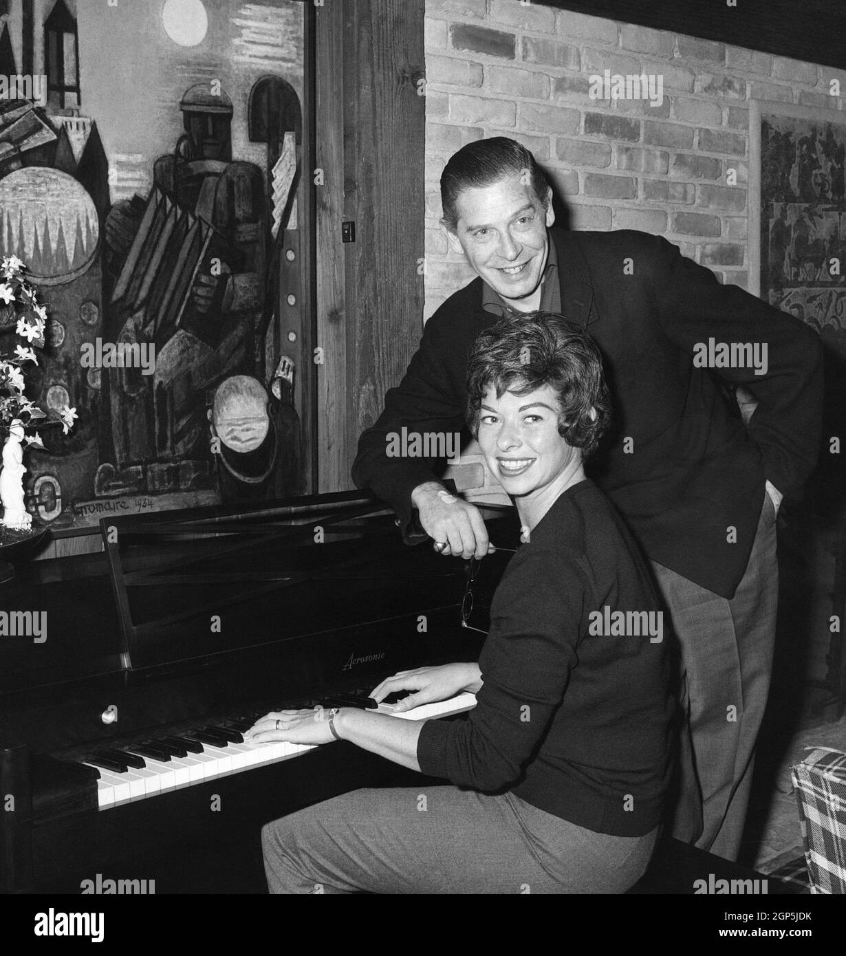 From left: Ruth Berle (playing piano), Milton Berle at home in ...