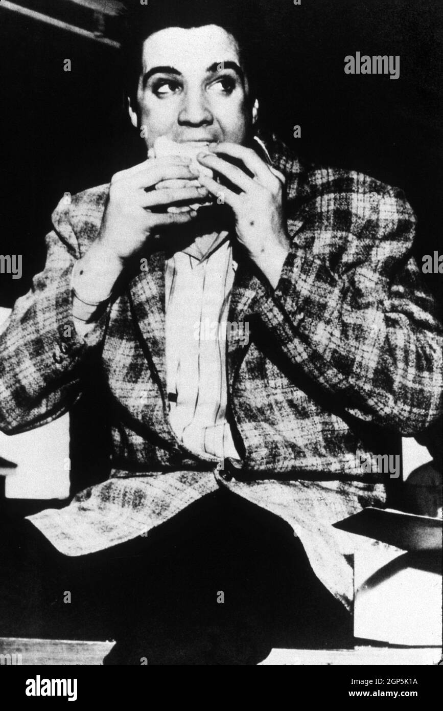 Elvis Presley, eating a sandwich, 1960s Stock Photo - Alamy