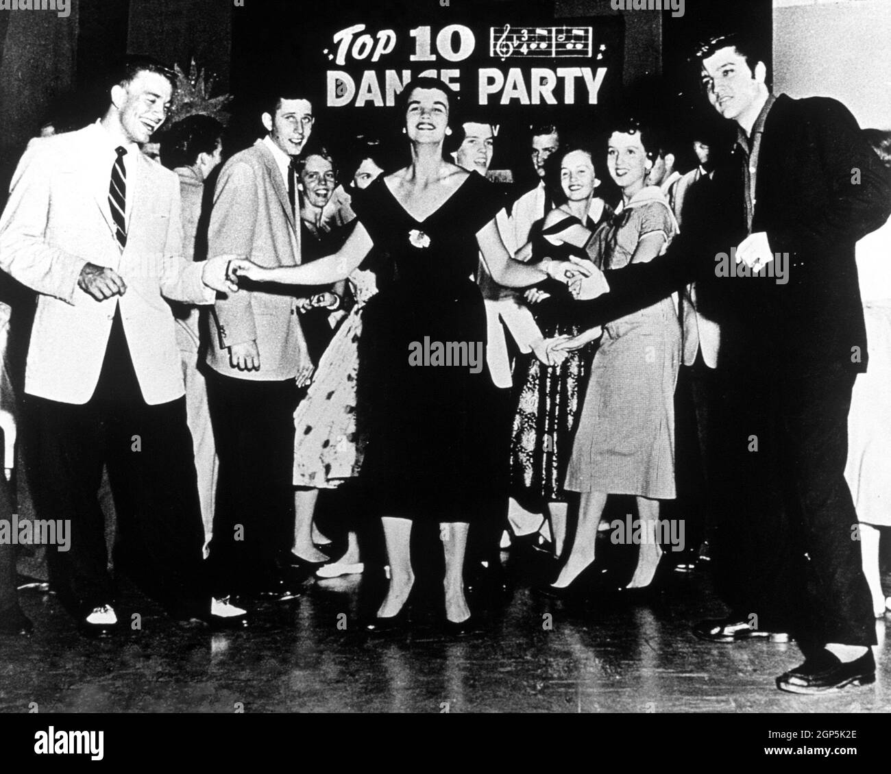 Elvis Presley, at right, with fans, 1950s Stock Photo - Alamy