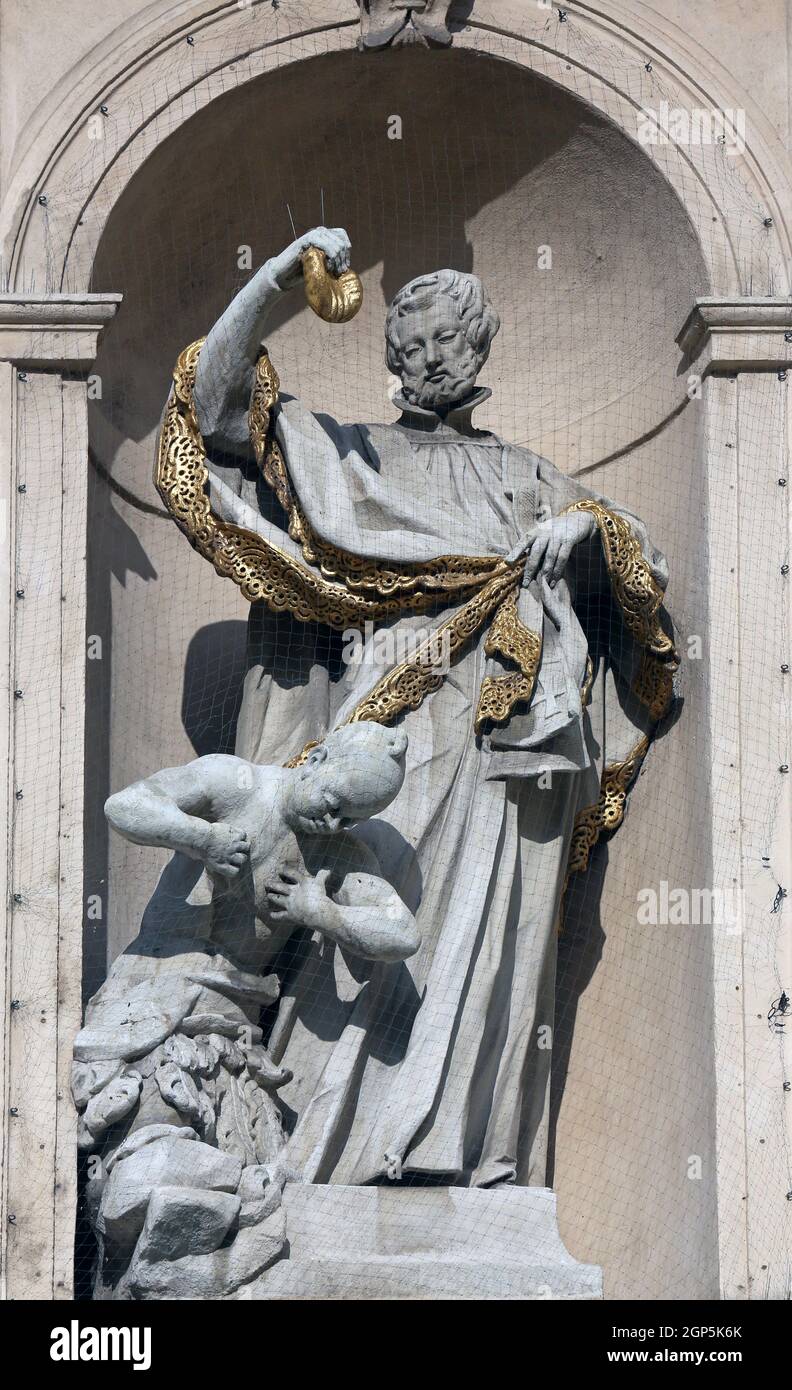 Statue of Saint on baroque Jesuits church in Vienna, Austria Stock ...