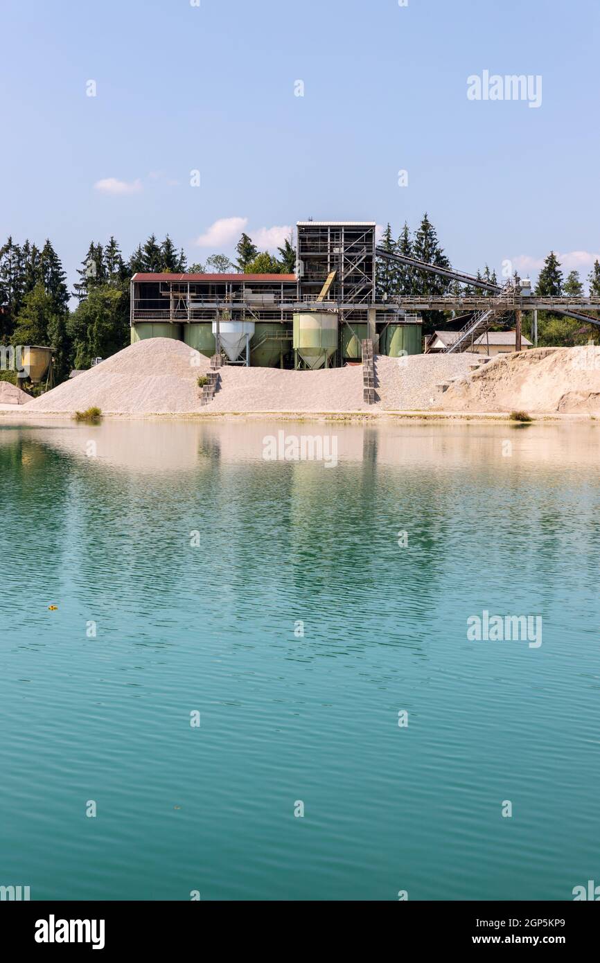 Gravel quarry at a beautiful blue lake, blue sky Stock Photo - Alamy