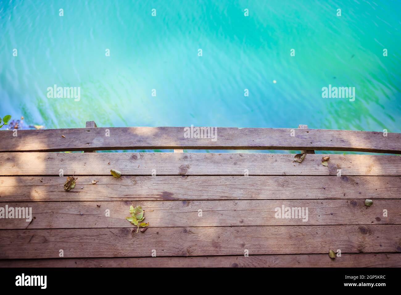 Rustic wooden dock pier and blue lake, text space Stock Photo - Alamy