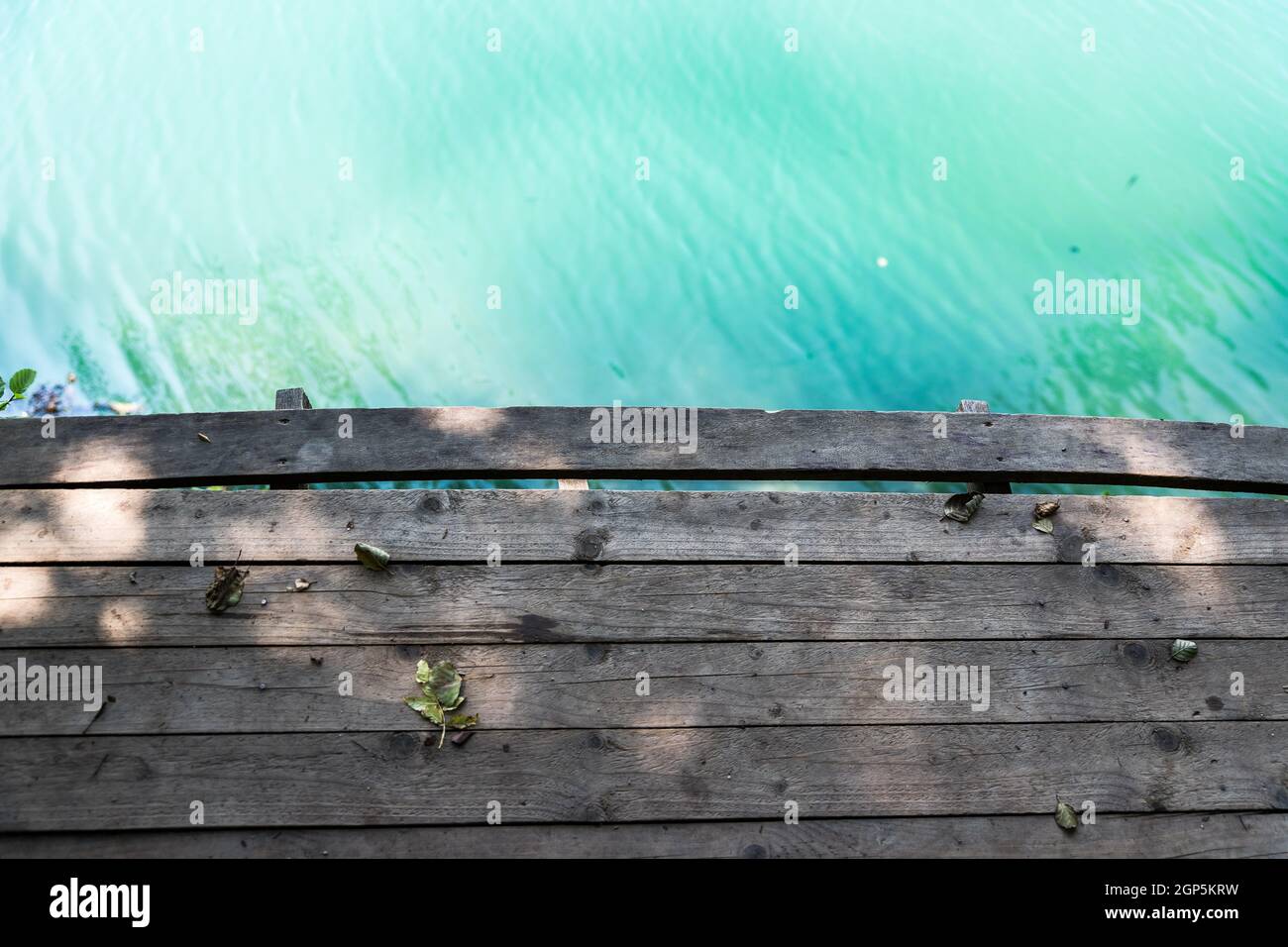 Rustic wooden dock pier and blue lake, text space Stock Photo - Alamy