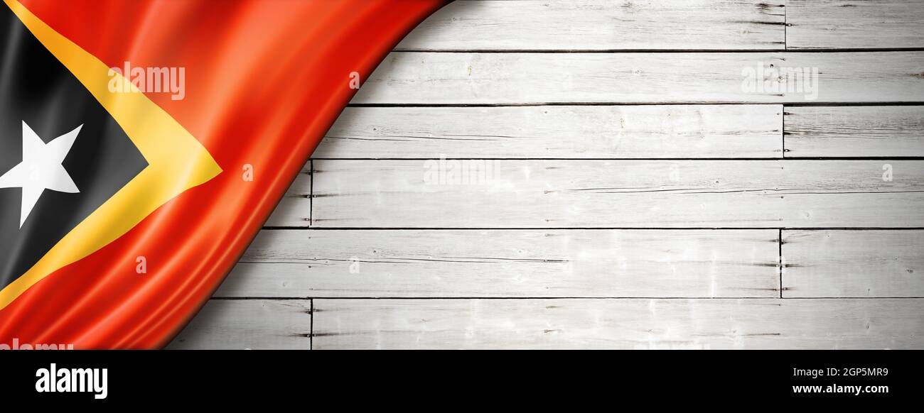 East Timor flag on old white wall. Horizontal panoramic banner Stock ...