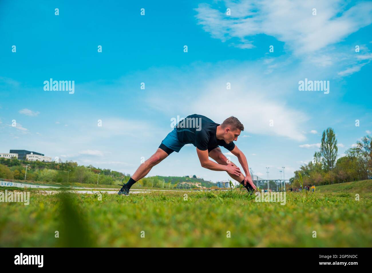 Stretching. Young caucasian male model in action, Concept of sport ...