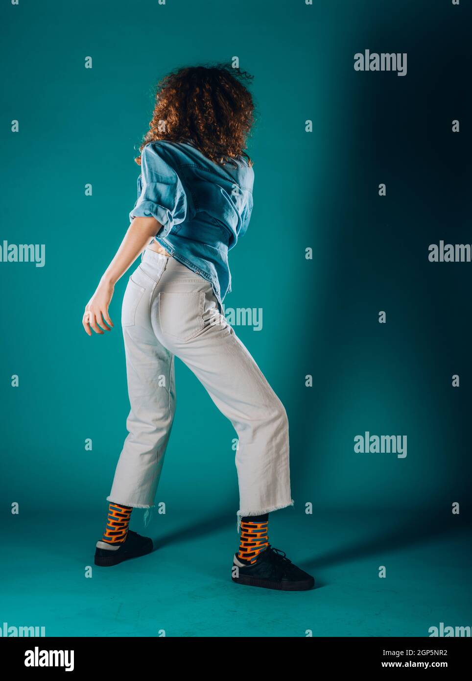 Flexible young silhouette dancer performing a stylish dance movement ...