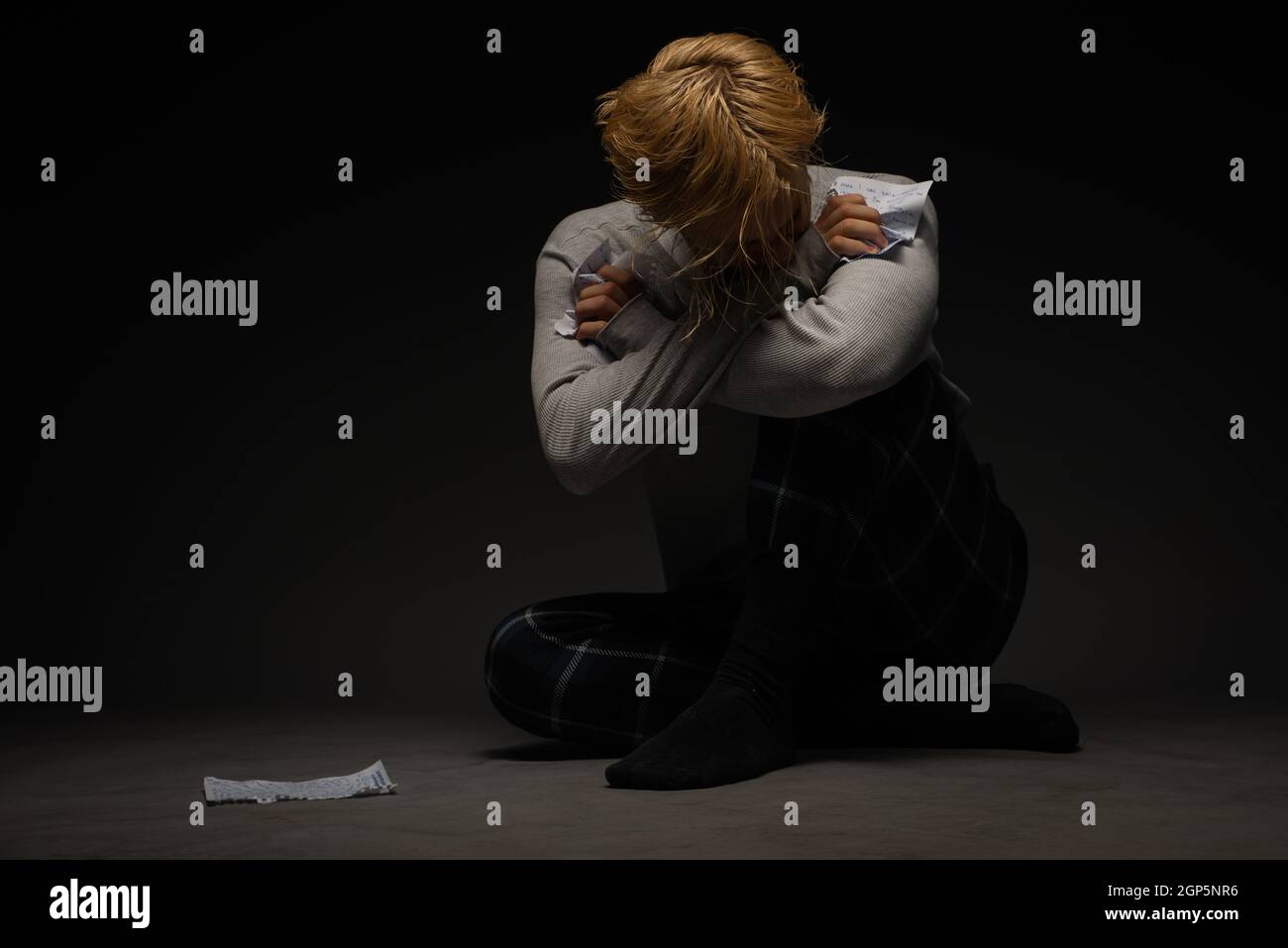 Sad boy is crying hard and suffering so much about the letters Stock ...