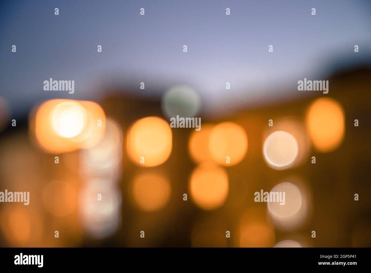 Blurry apartment block at dusk, urban city life, lights Stock Photo - Alamy