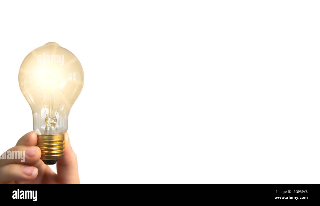 Hand holding glowing light bulb,finding innovative solutions and ...