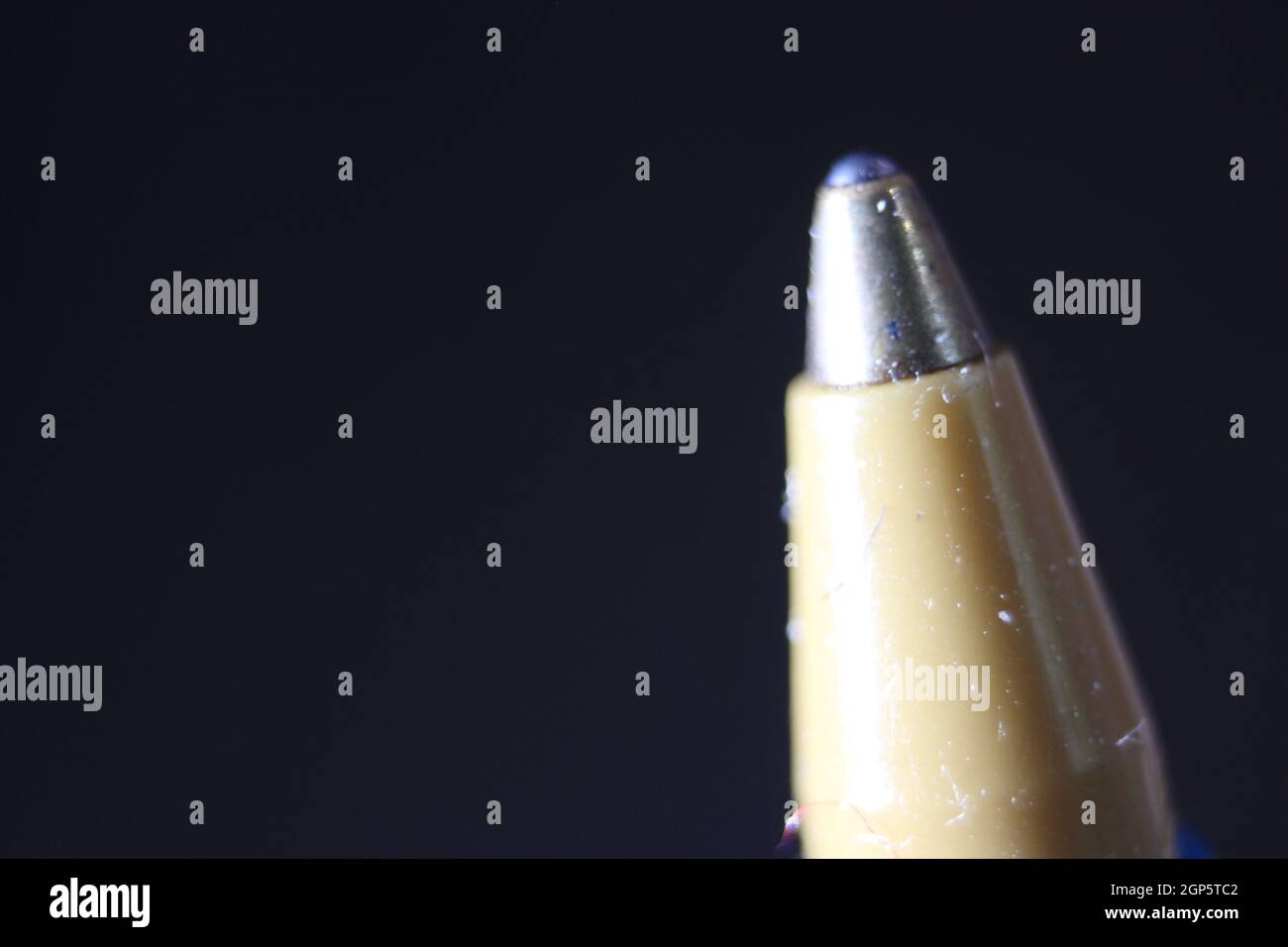 Macro photo of ballpoint pen tip with dark grey background. Extreme ...