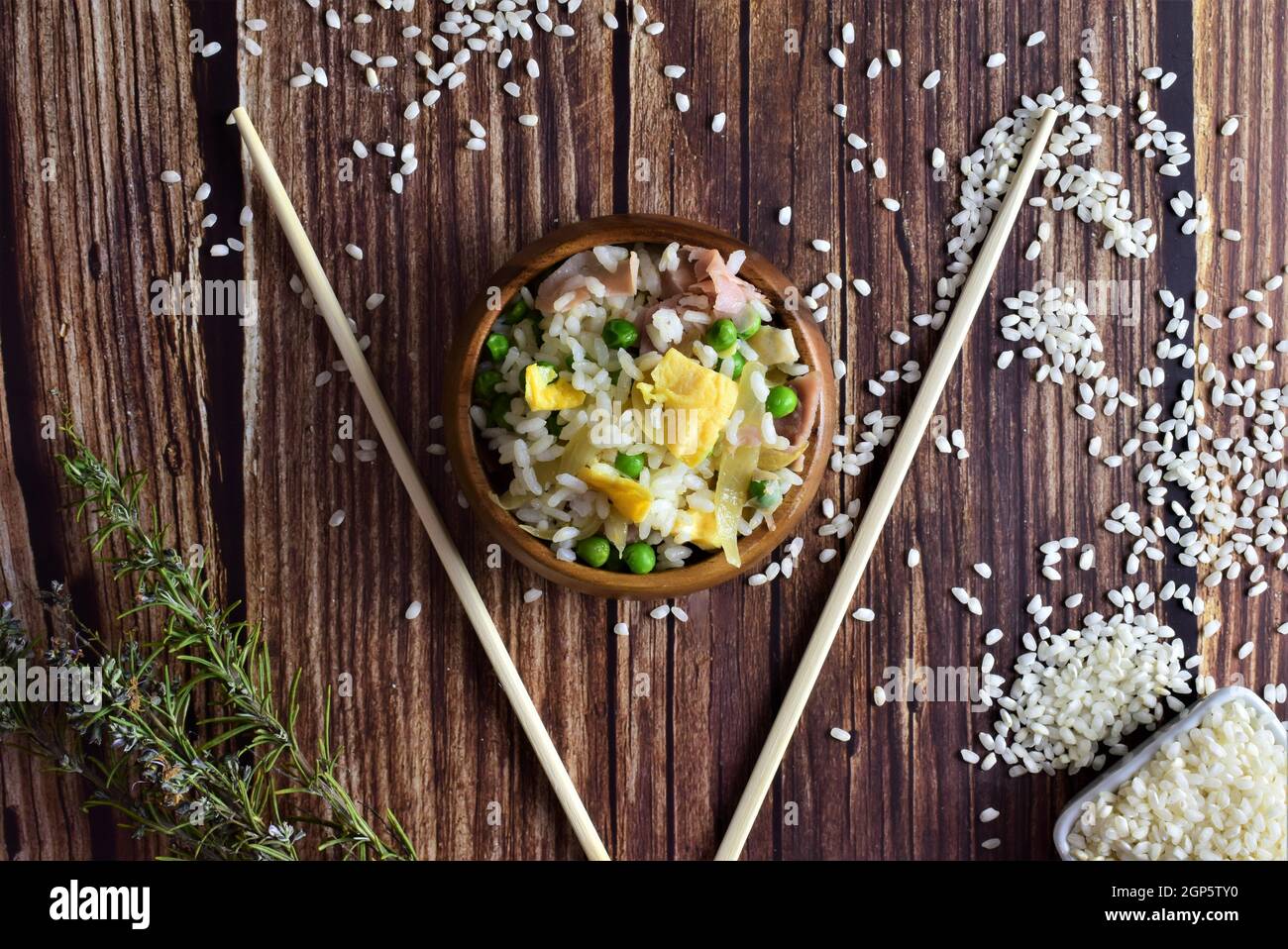 Top view shot of a plate full of rice three delights, and chopsticks on ...