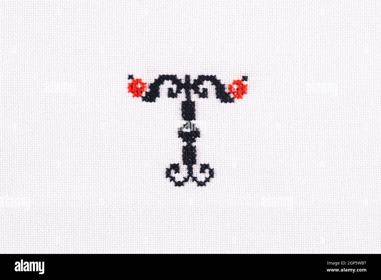 Letter T of Embroidered Cross - Stitch Latin Alphabet on White Linen ...