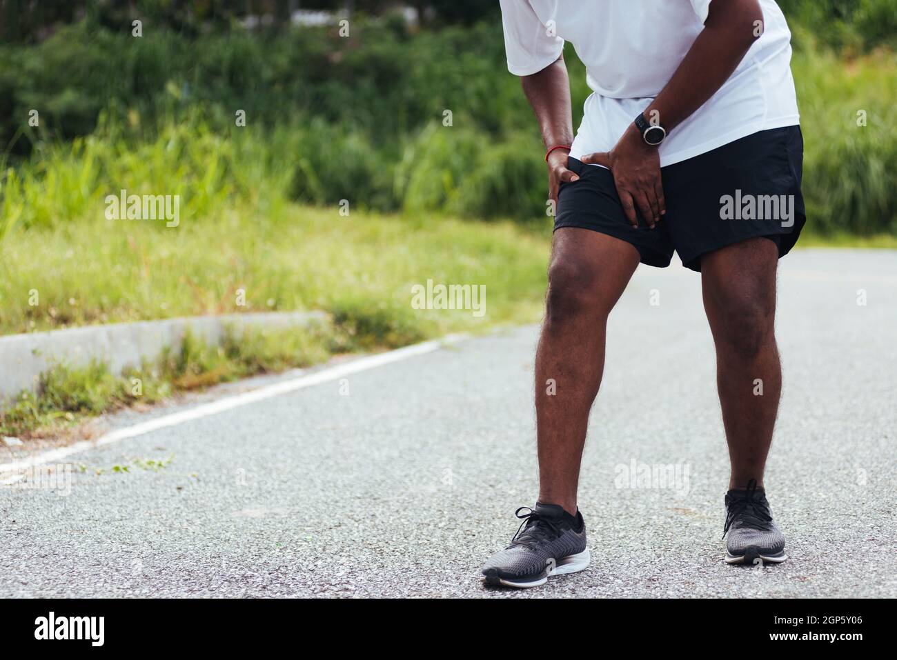 Grabbing leg hi-res stock photography and images - Alamy