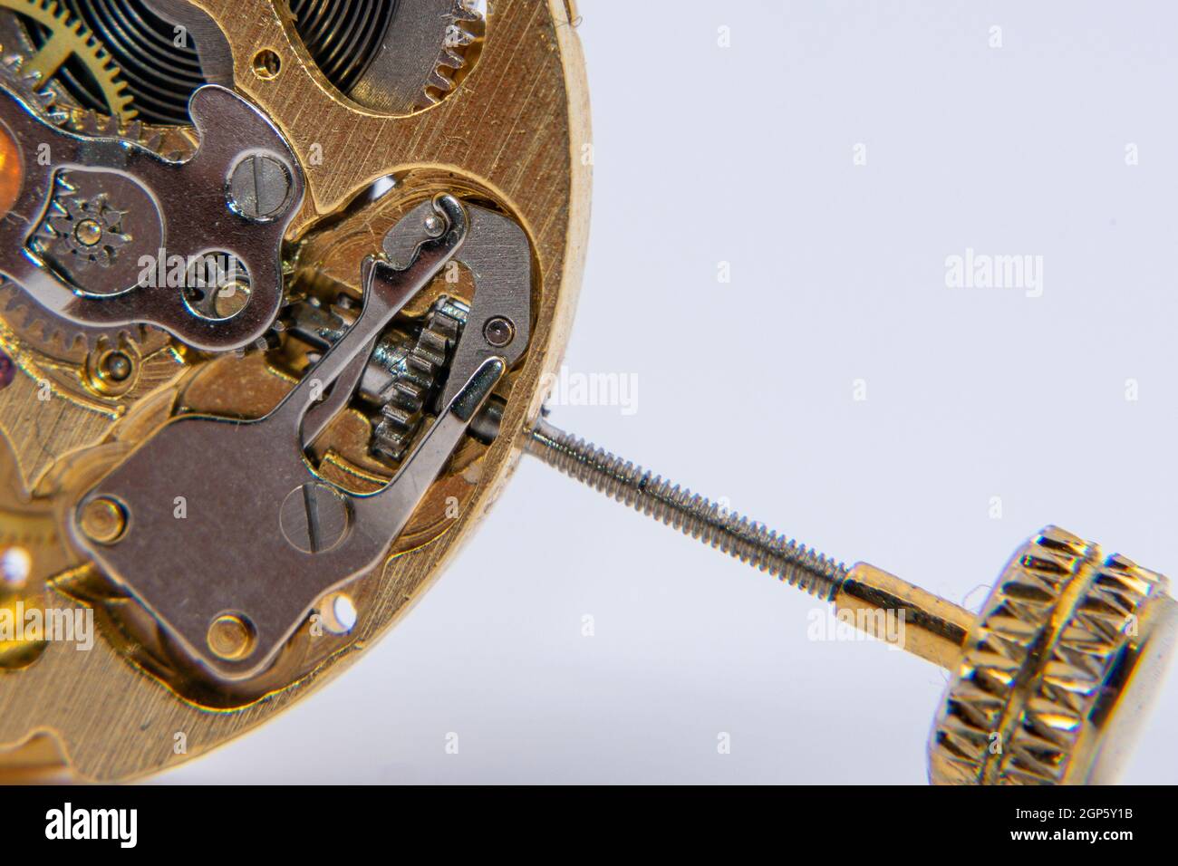Closeup of the crown and other mechanical parts of an automatic watch ...