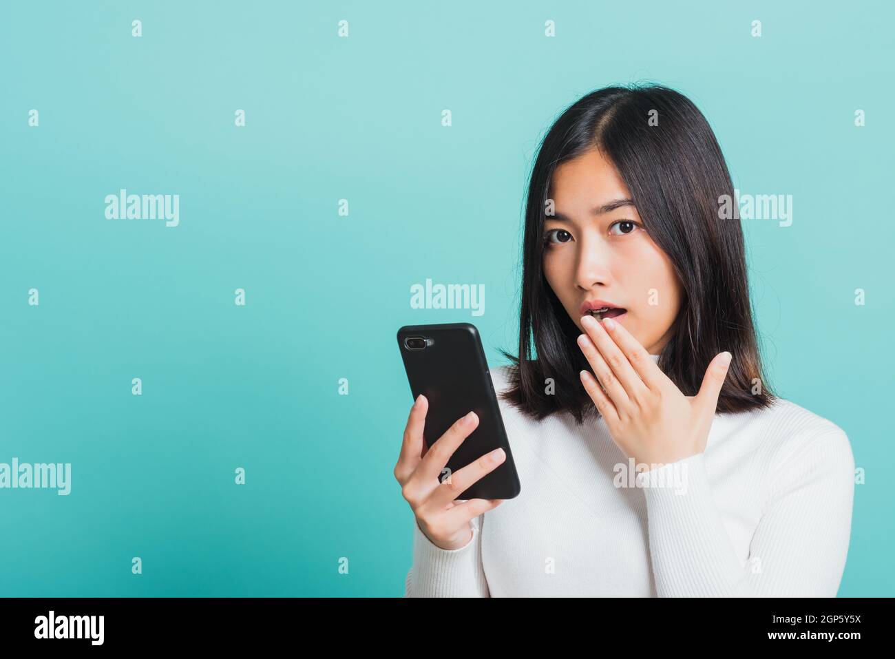 Portrait female anxious scared on the phone seeing bad news, Young ...