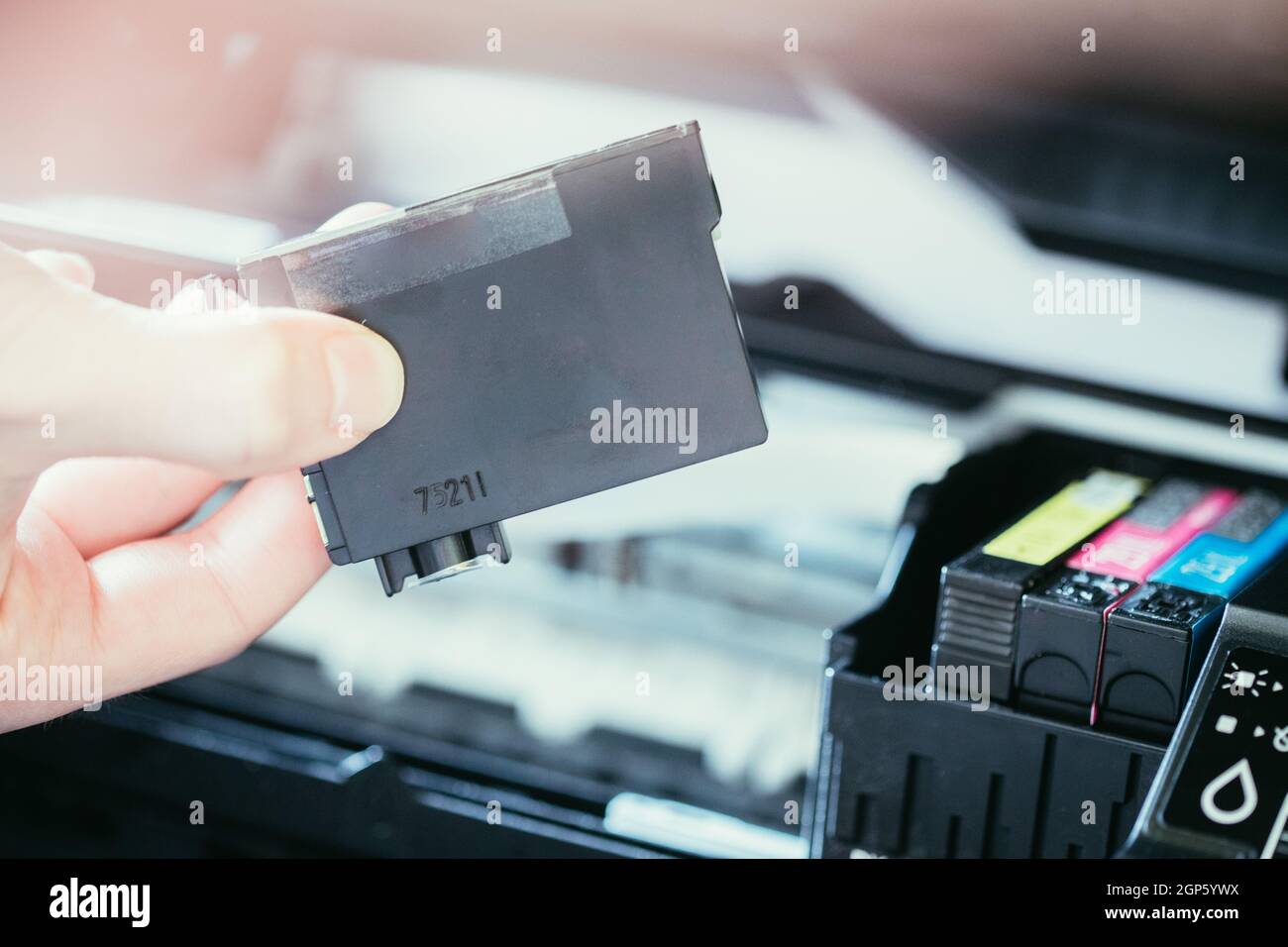 Putting new printer cartridge into the printer, inkjet Stock Photo - Alamy