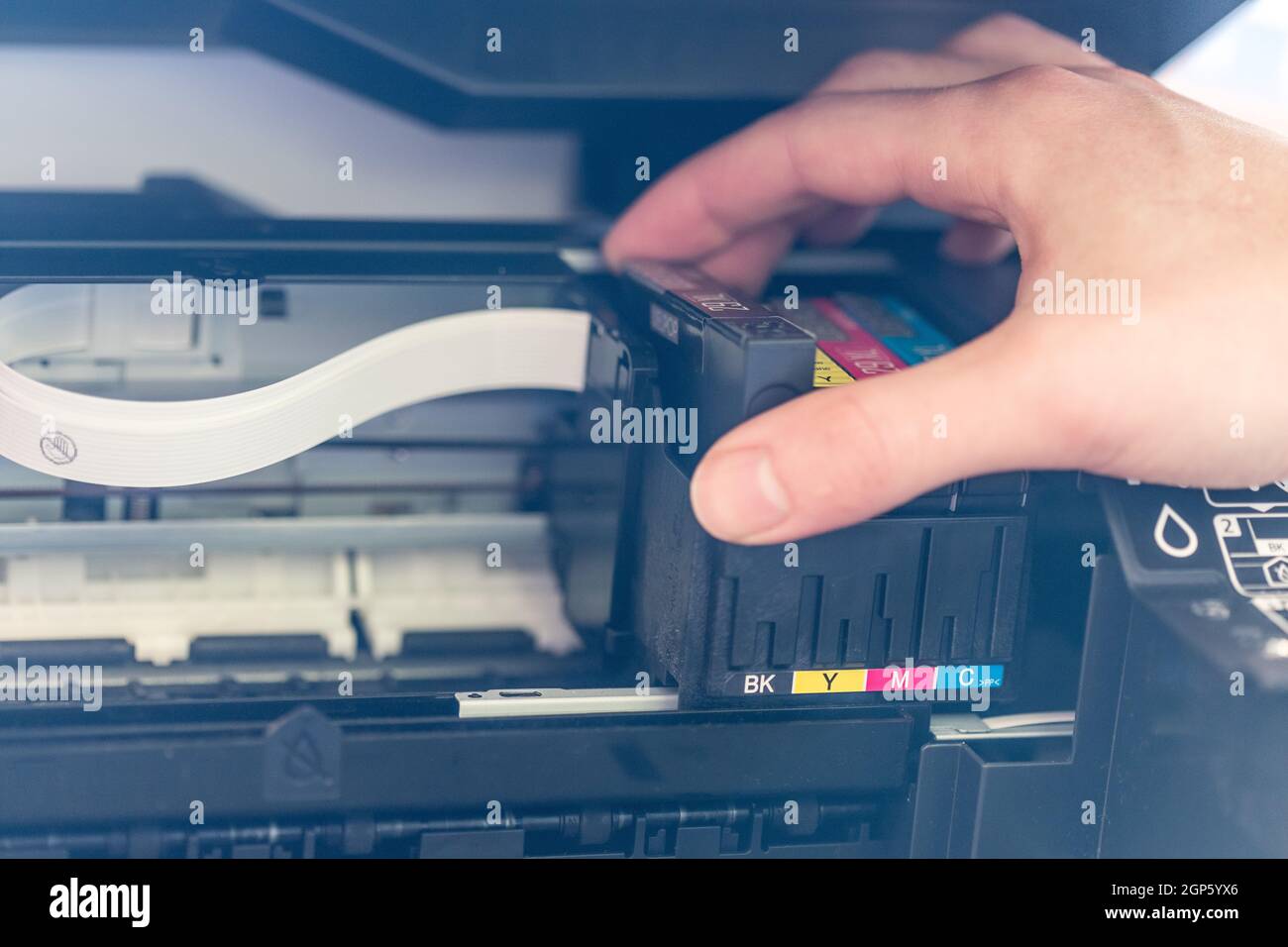 Putting new printer cartridge into the printer, inkjet Stock Photo - Alamy