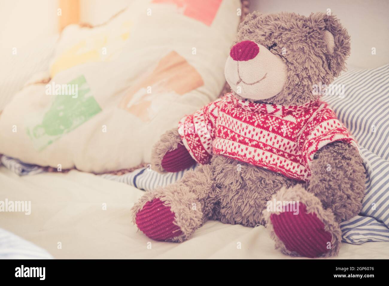 Cute teddy bear toy is sitting in the bed, wakeup at morning Stock ...