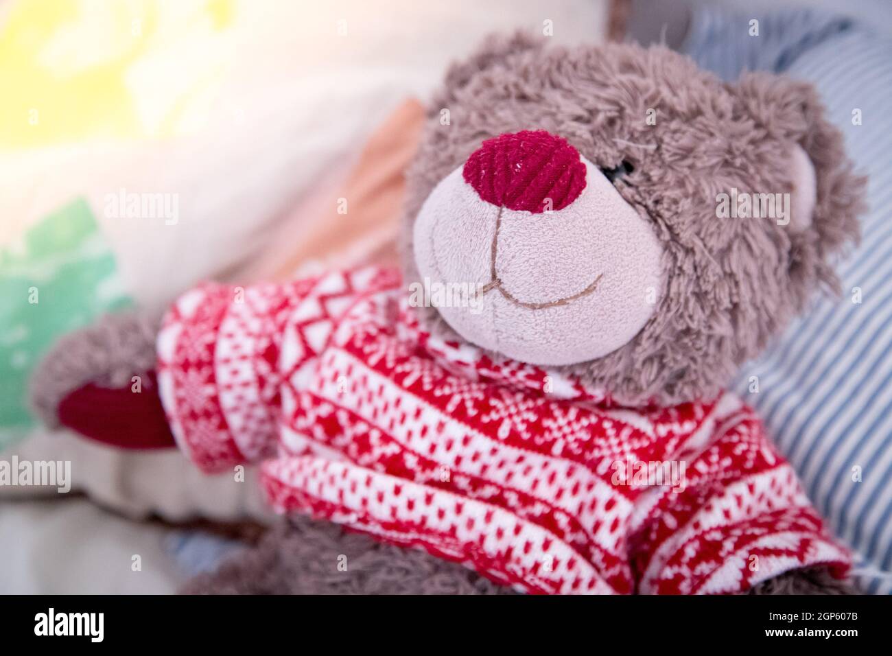 Cute teddy bear toy is sitting in the bed, wakeup at morning Stock ...