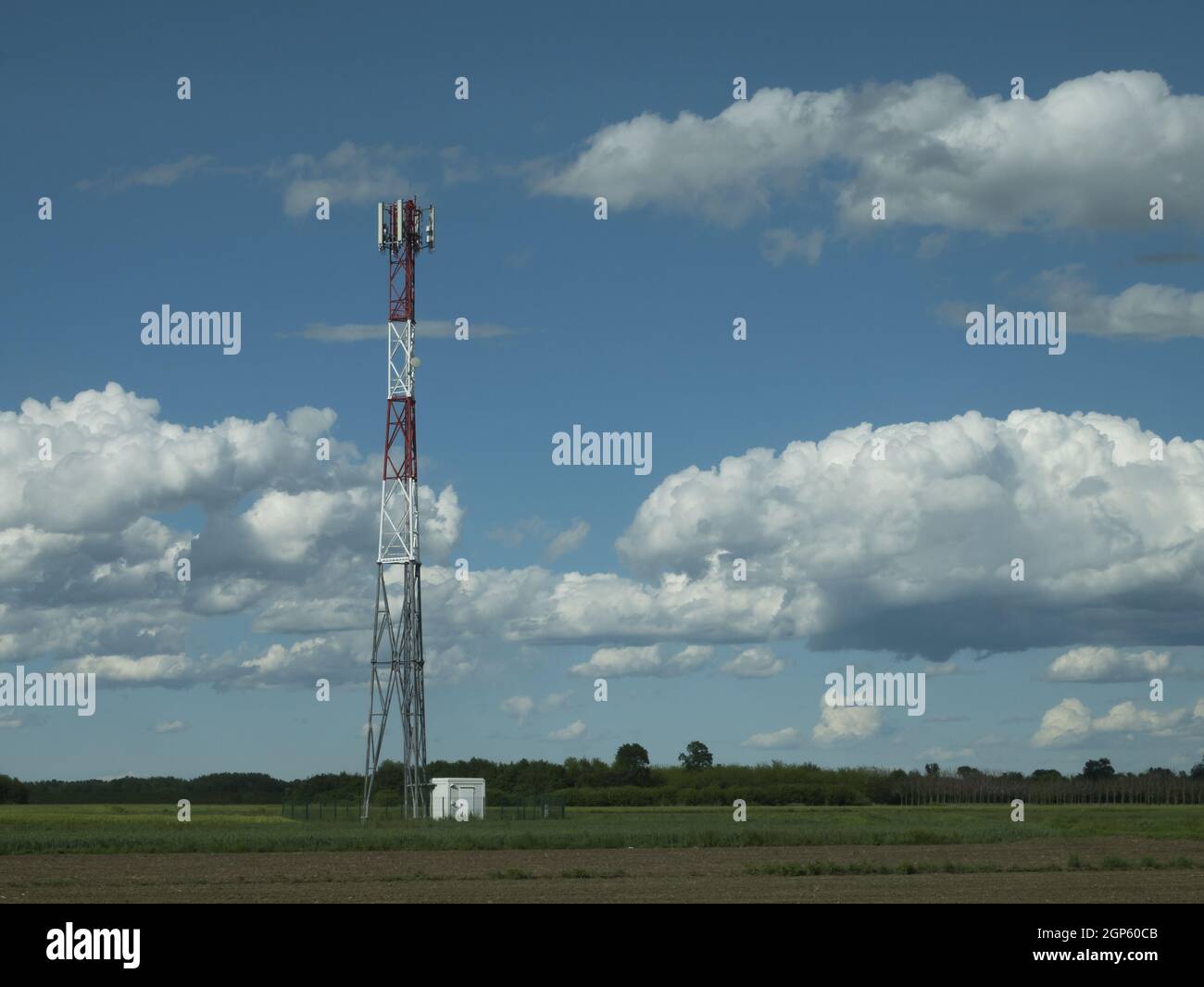 G5 cell phone tower base station against blue sky with clouds Stock ...