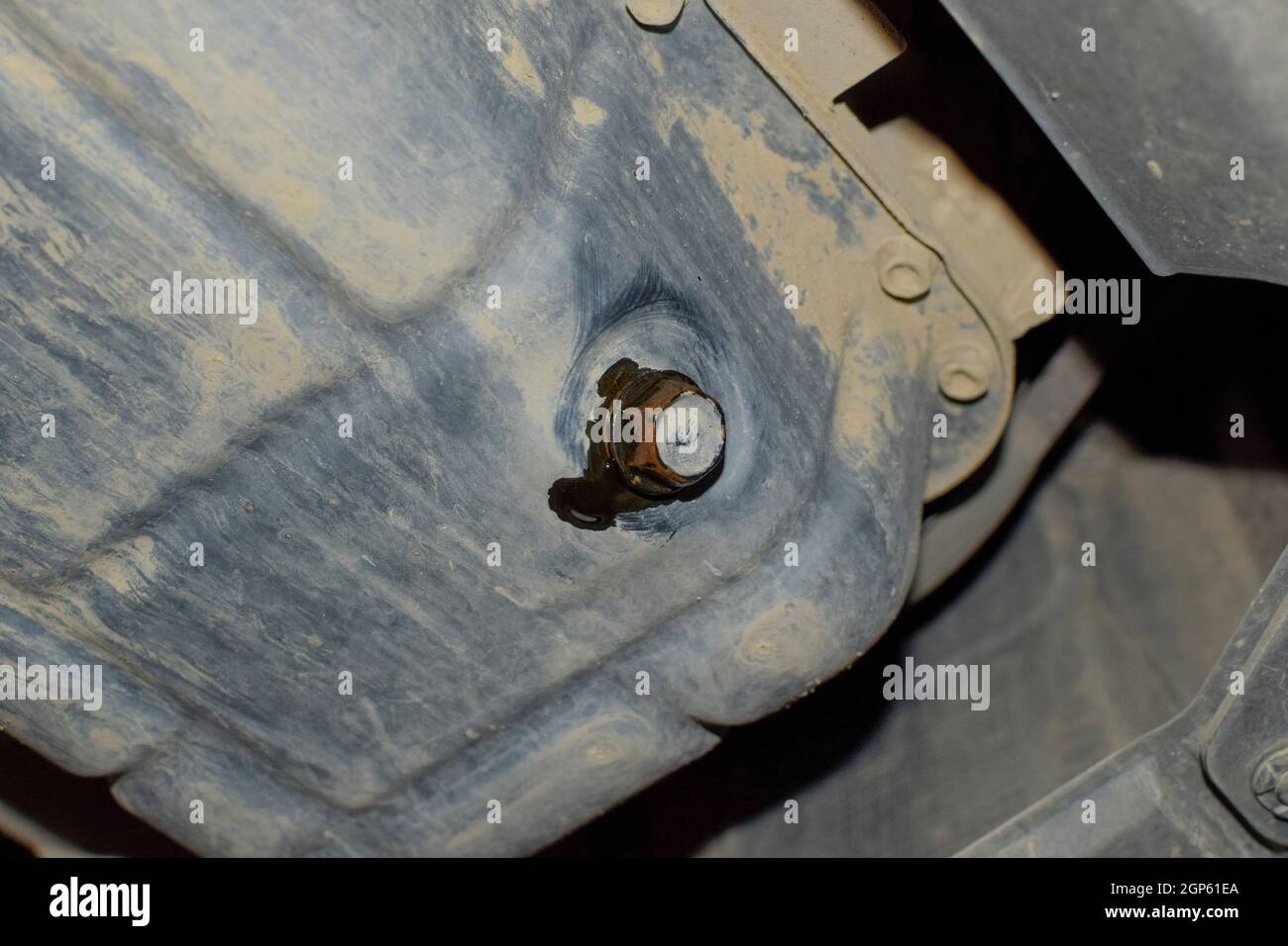 Drain the old oil from the engine through the drain plug. Changing the ...