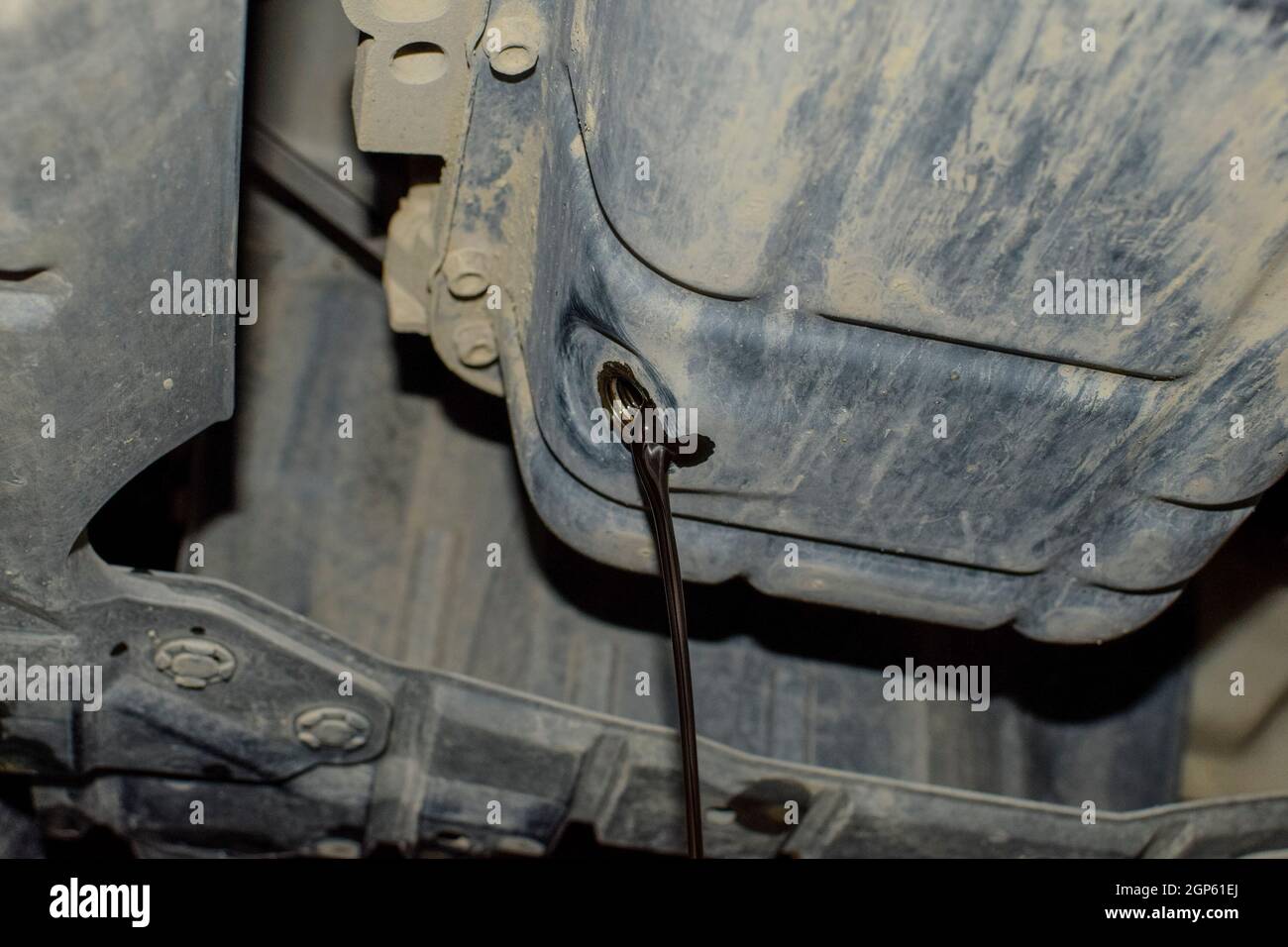 Drain the old oil from the engine through the drain plug. Changing the ...