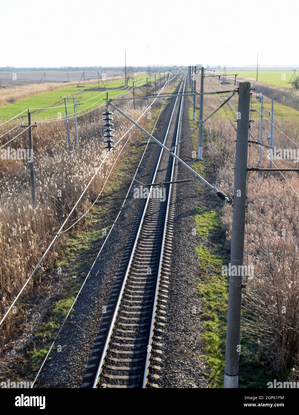 Plot railway. Top view on the rails. High-voltage power lines for ...