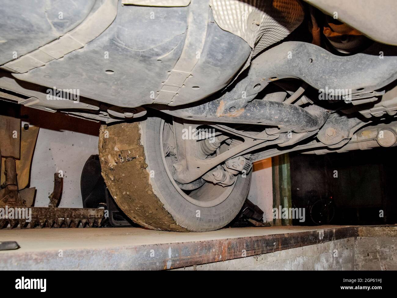 Rear wheel of the car with the elements of the suspension system. Car ...