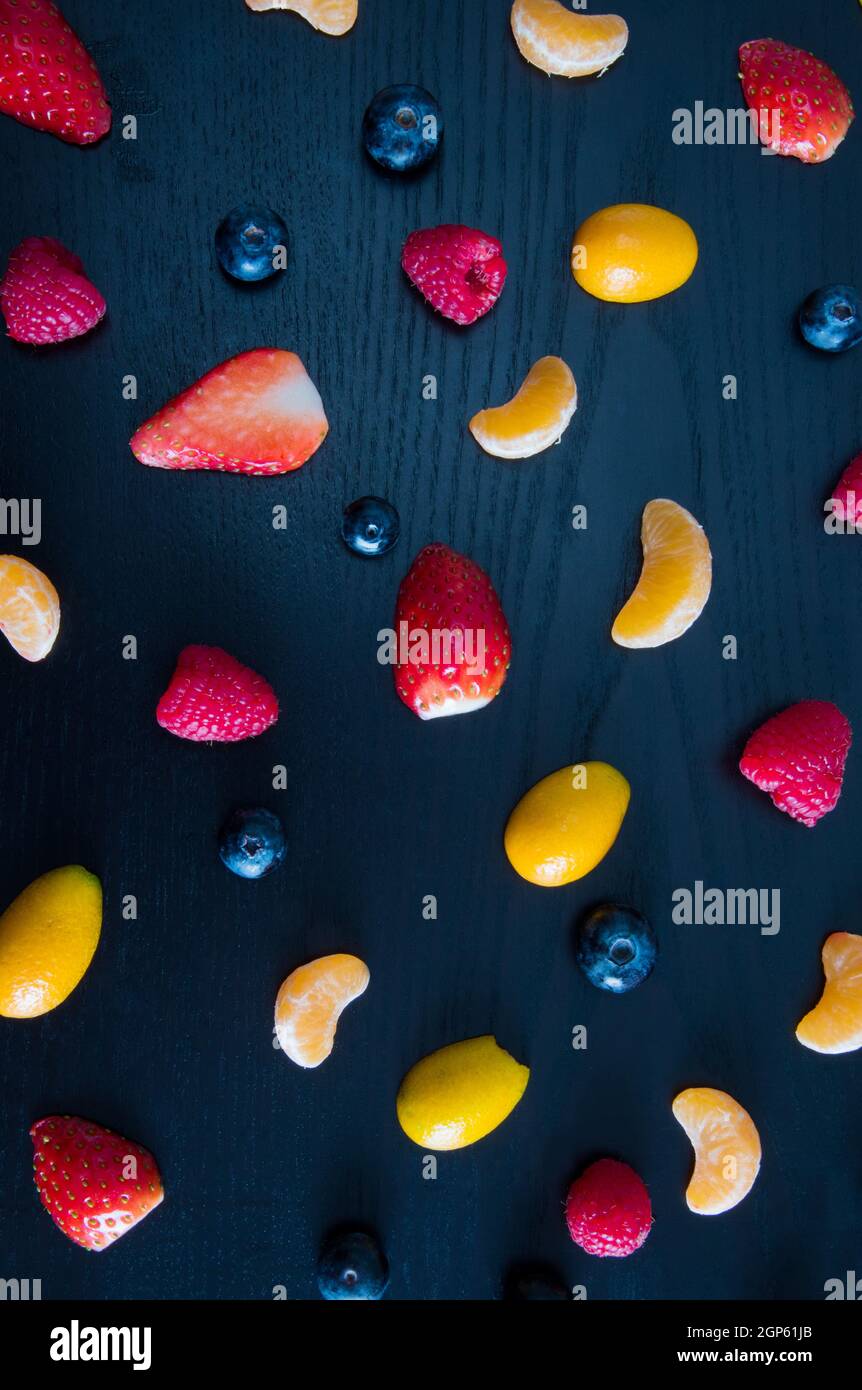 top of view of Colorful pattern made of tangerine,raspberry,blueberry ...