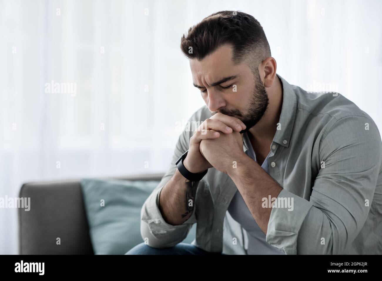 Shame, regret or despair. Sad lonely young man with depression or ...