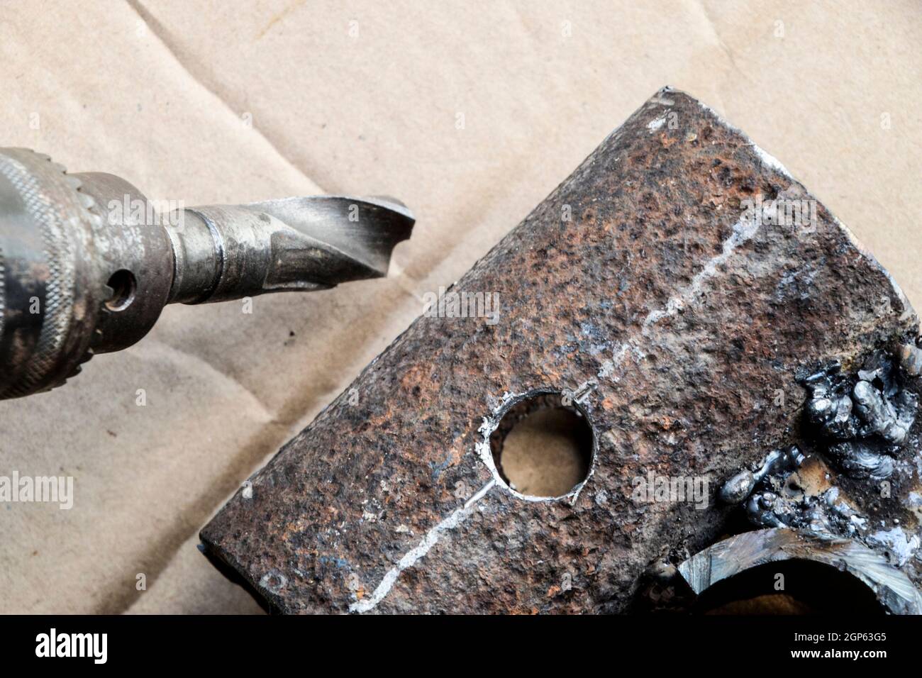 Drill for metal. A drilled hole in the steel part Stock Photo - Alamy