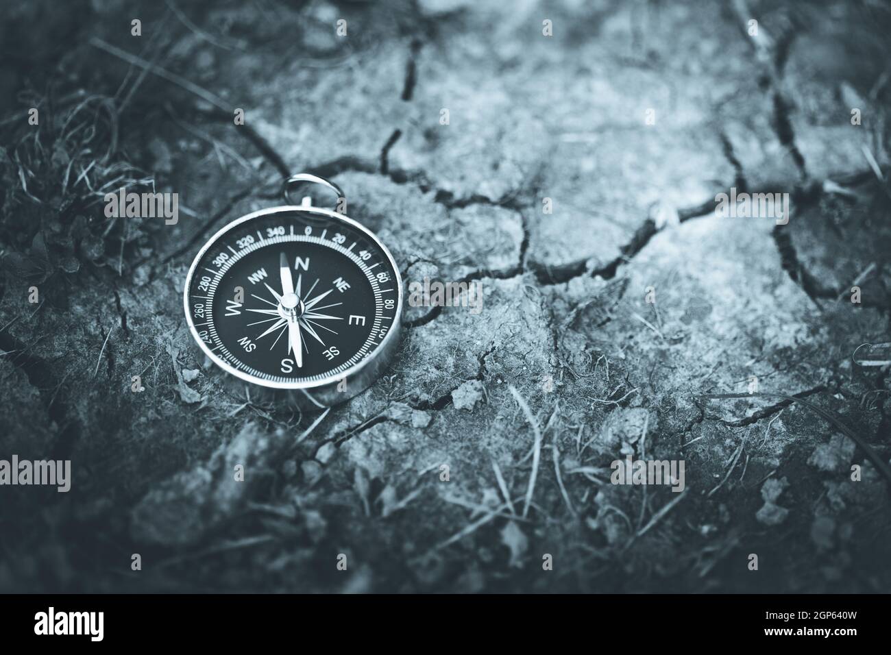 Vintage compass lying on the floor. Adventure and discovery concept ...