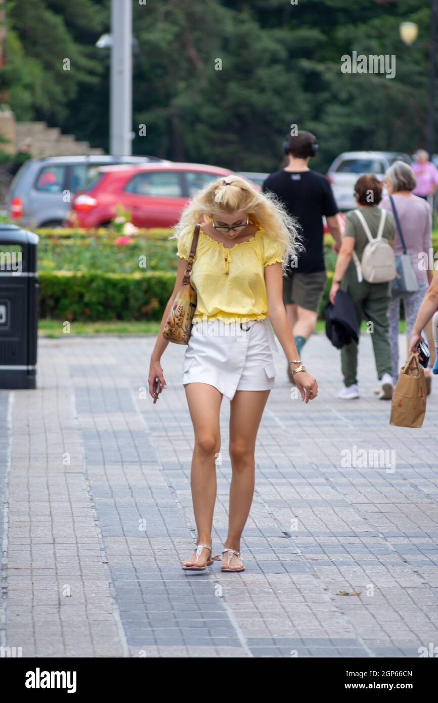 Timisoara, Romania - July 20, 2021: Woman walking on the street. Real ...
