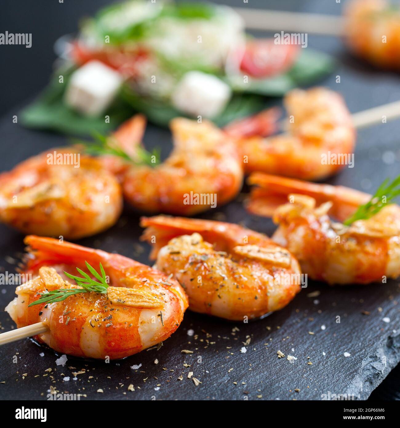 Macro close up of giant aromatic prawn tails spiced with natural herbs ...