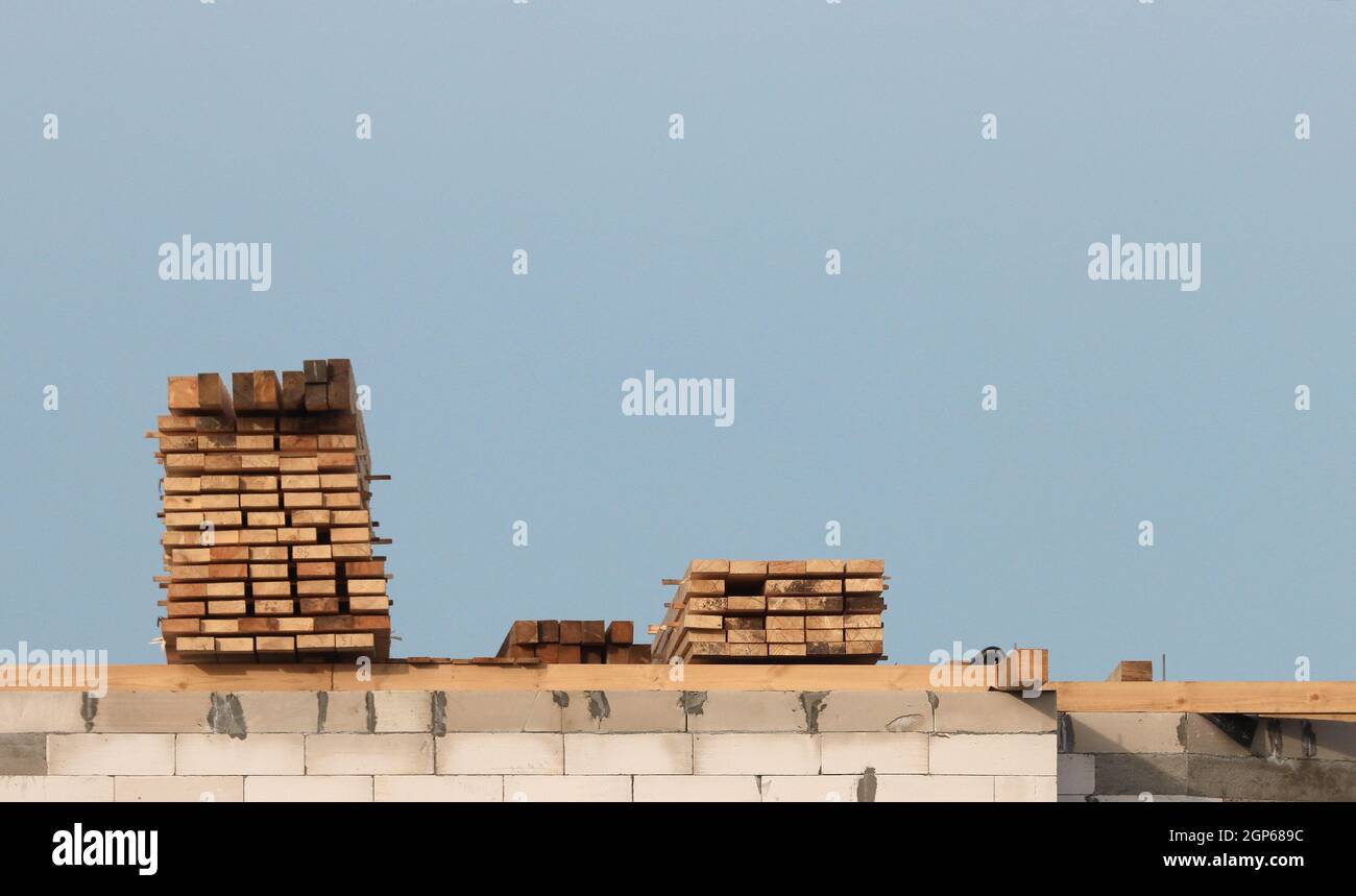 Beams and planks folded for roof construction Stock Photo - Alamy