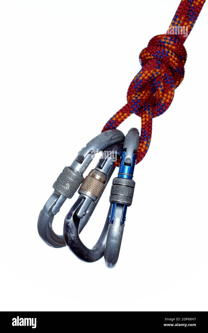 three climbing hooks with rope on white background Stock Photo - Alamy